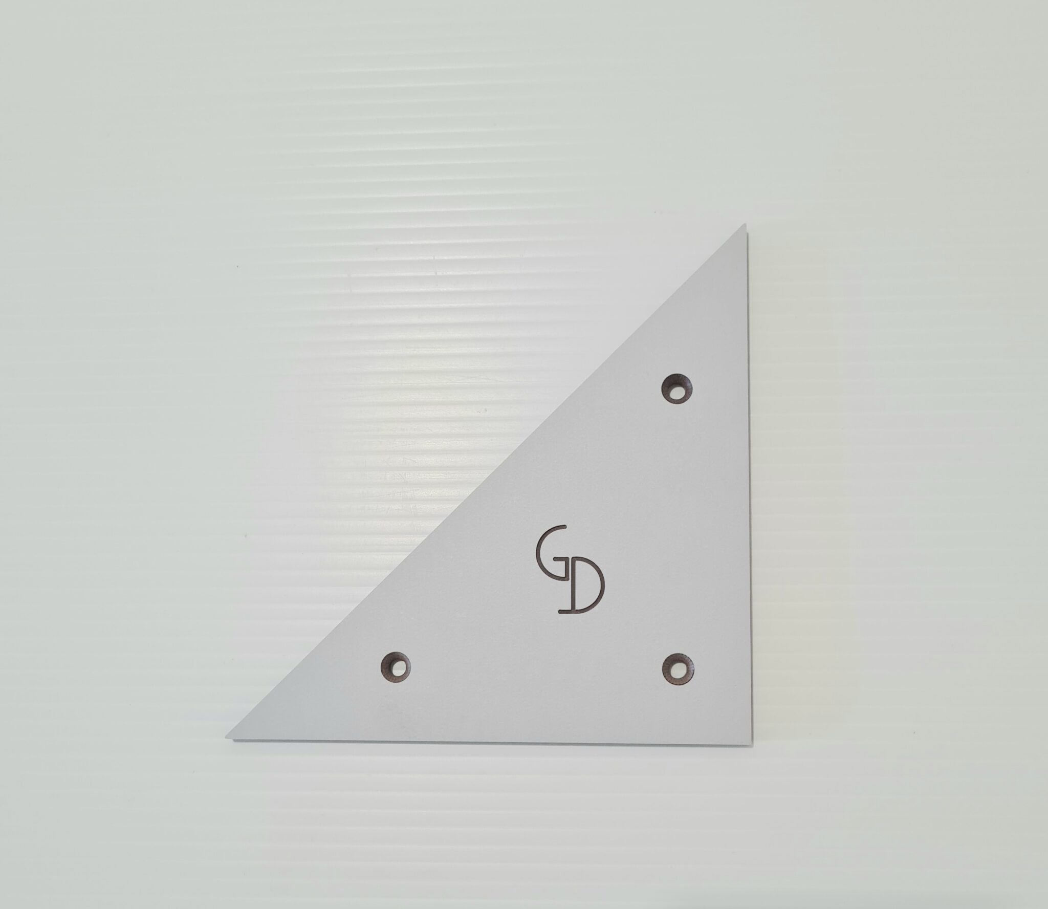 Use 45 degree triangle to check for a 45 degree angles in mitered corners.